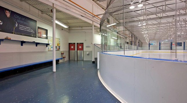 Norma Bush and Father David Bauer Arenas