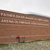 Norma Bush and Father David Bauer Arenas